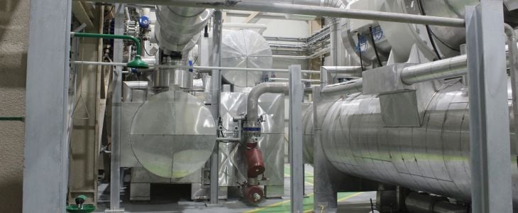 How do magnetic bearings work in a centrifugal compressor?